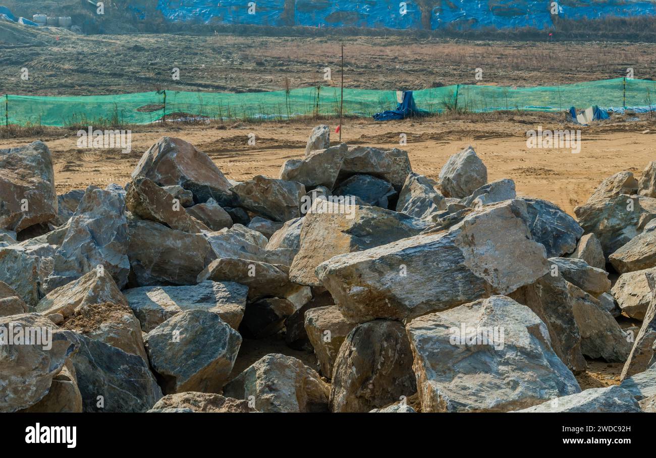 Pile of large granite boulders at construction site on sunny day, South ...