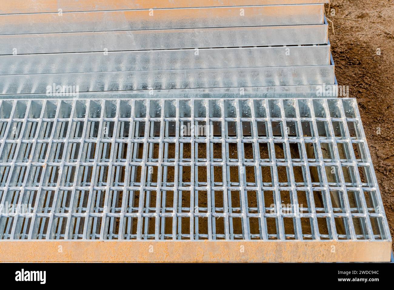 Metal grate sections used to cover water drainage culverts at new ...