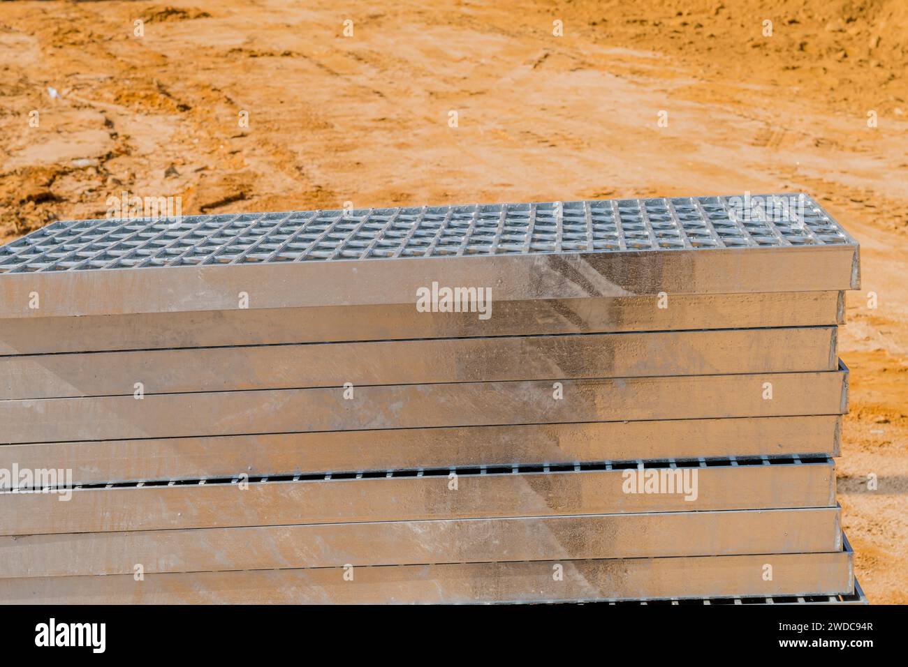 Stack of metal grate sections used to cover water drainage culverts at ...