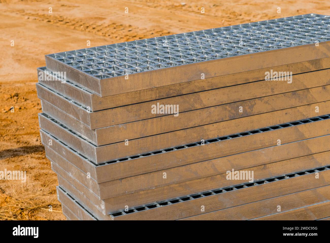 Stack of metal grate sections used to cover water drainage culverts at ...