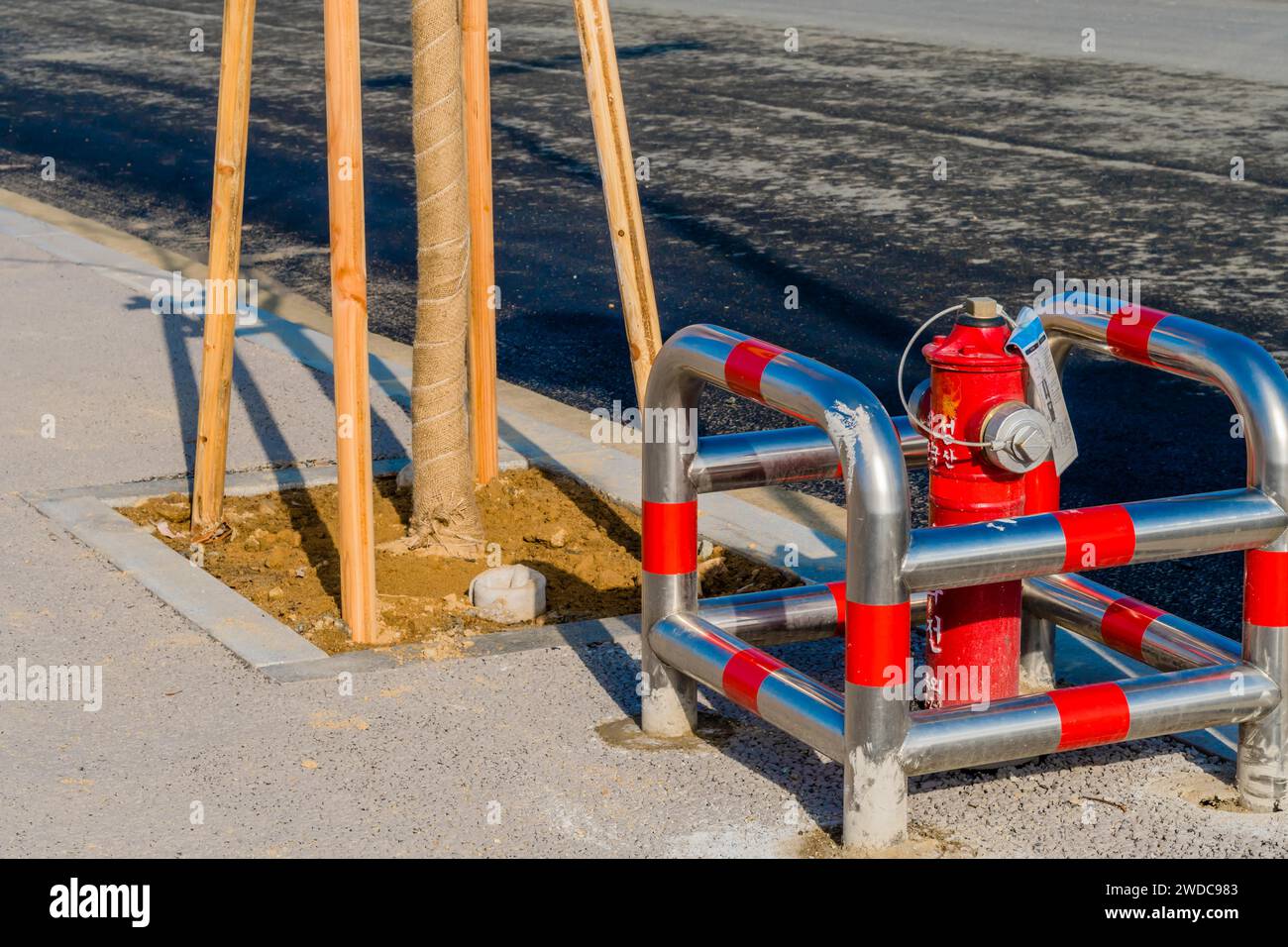 Daejeonn, South Korea, December 25, 2019: New fire hydrant inside steel cage installed in ...
