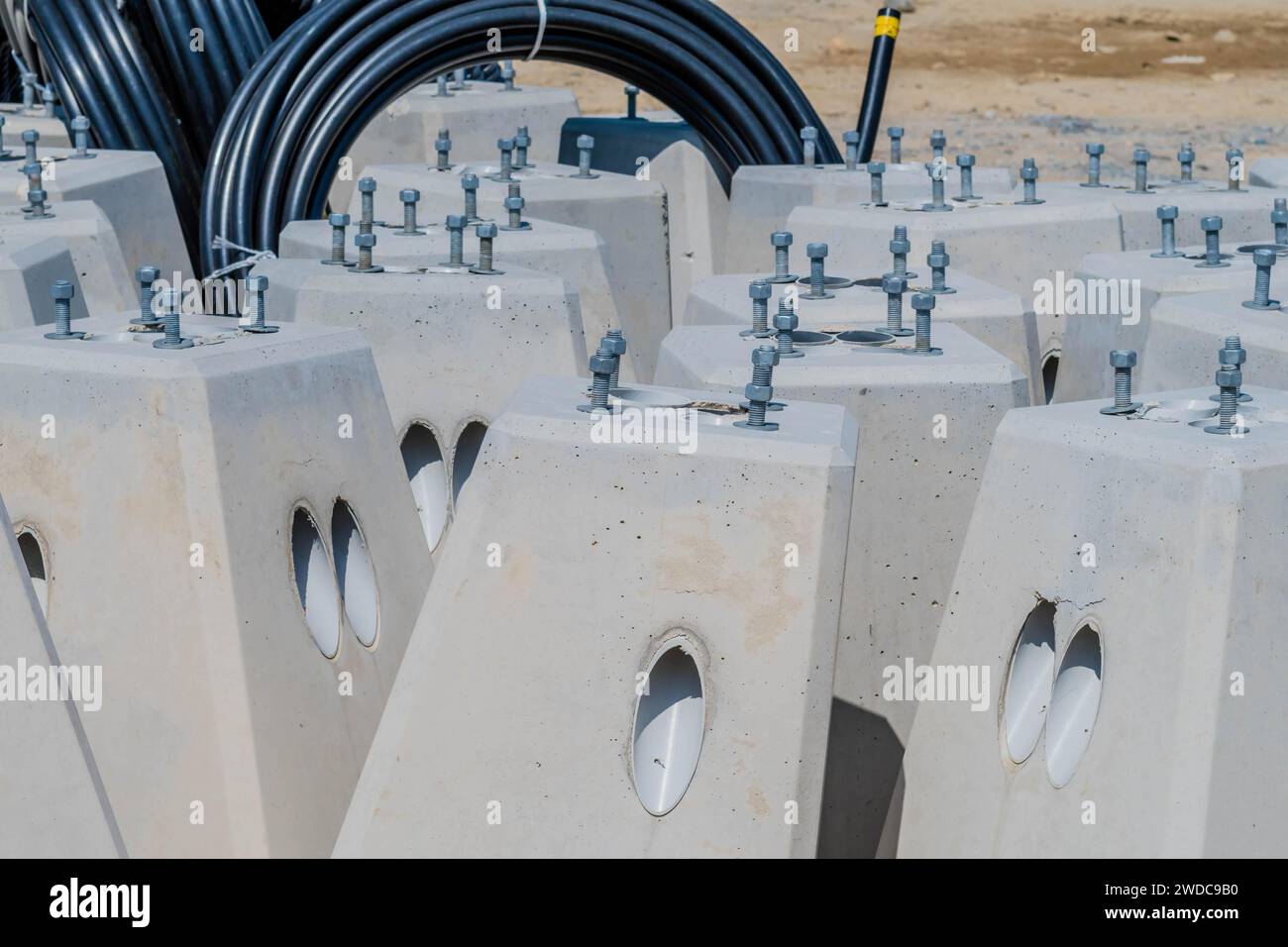Concrete bases for lampposts at construction staging area in front of ...
