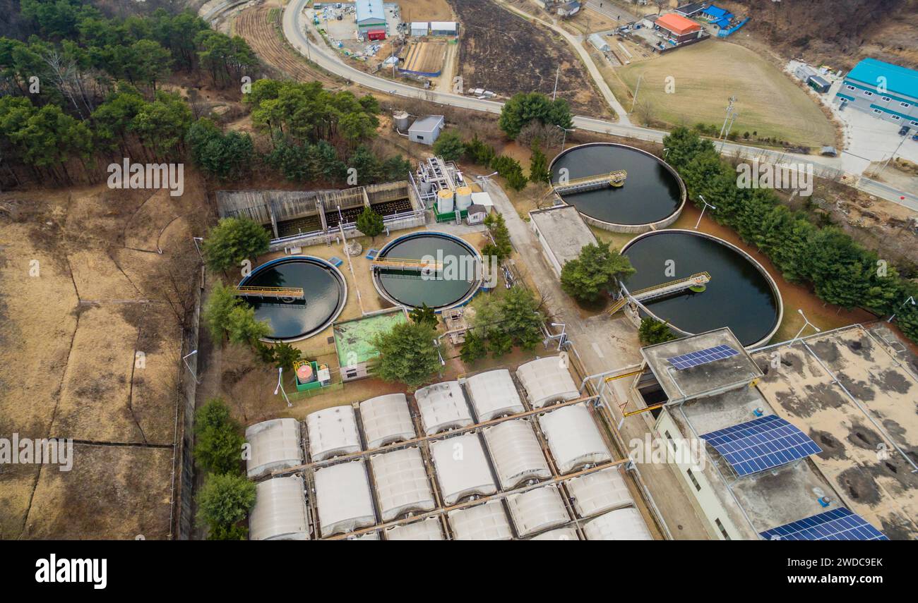 Aerial view of pools of water and buildings at water treatment plant in ...