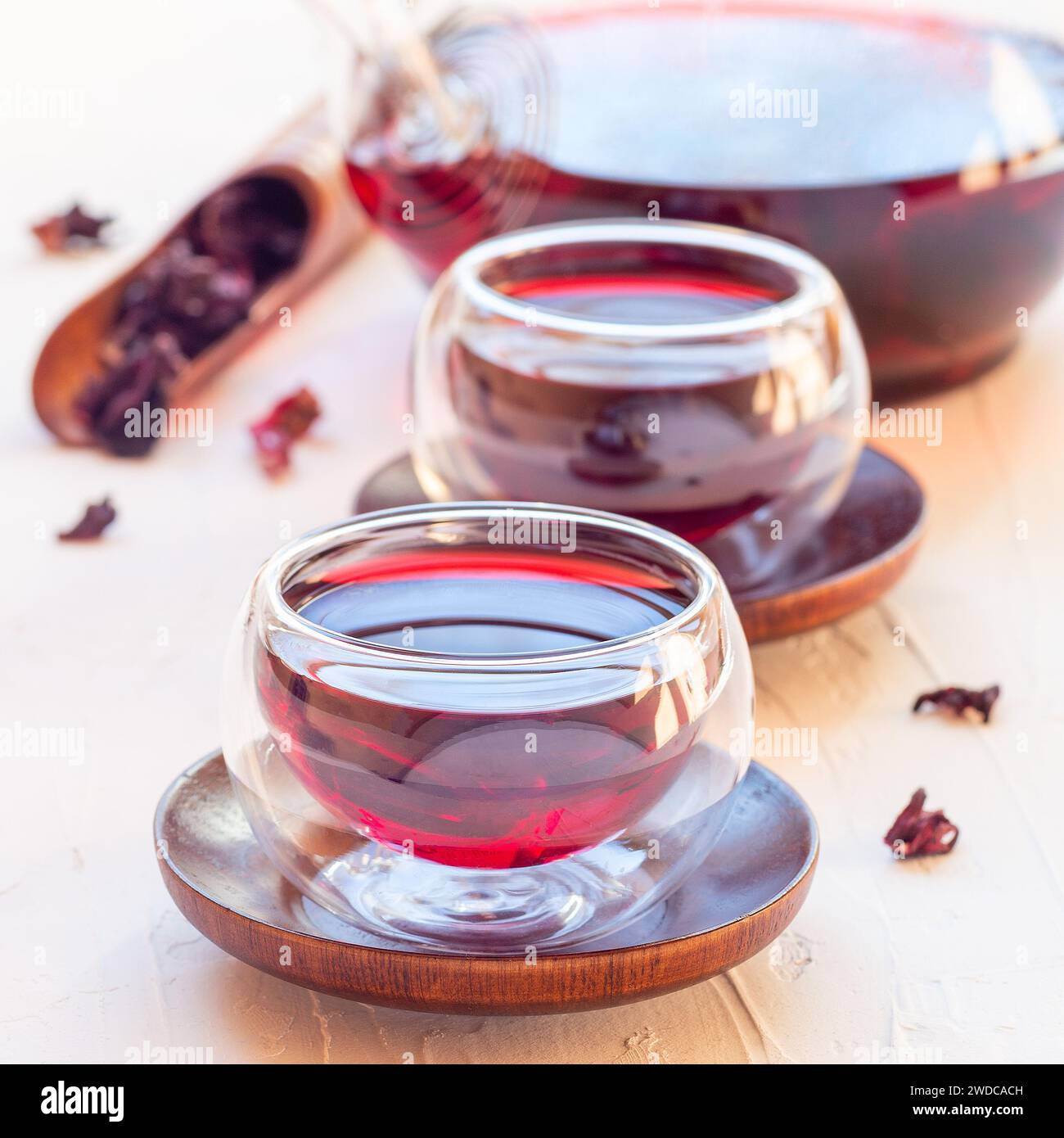 Red tea karkade or hibiscus in glass cups, vertical, square format ...