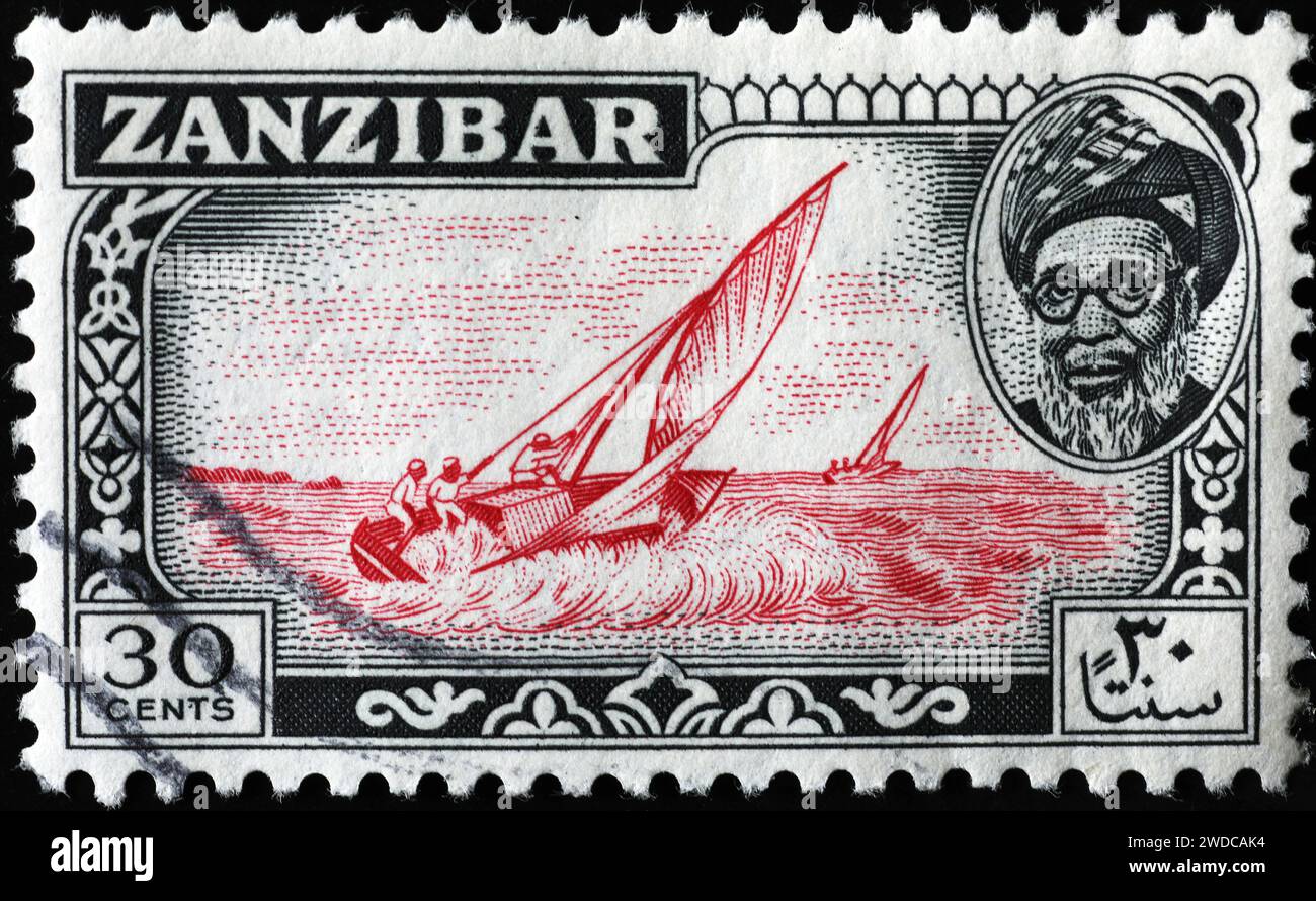 Ancient postage stamp of Zanzibar with a sailboat Stock Photo - Alamy