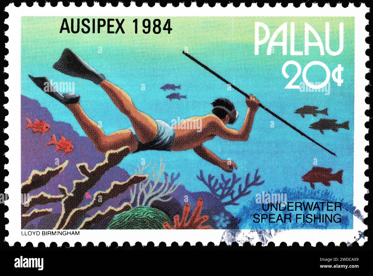 Diving fisherman on postage stamp of Palau Stock Photo - Alamy