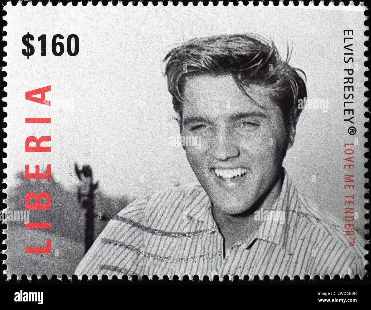Elvis Presley in movie 'Love me tender' on postage stamp Stock Photo ...