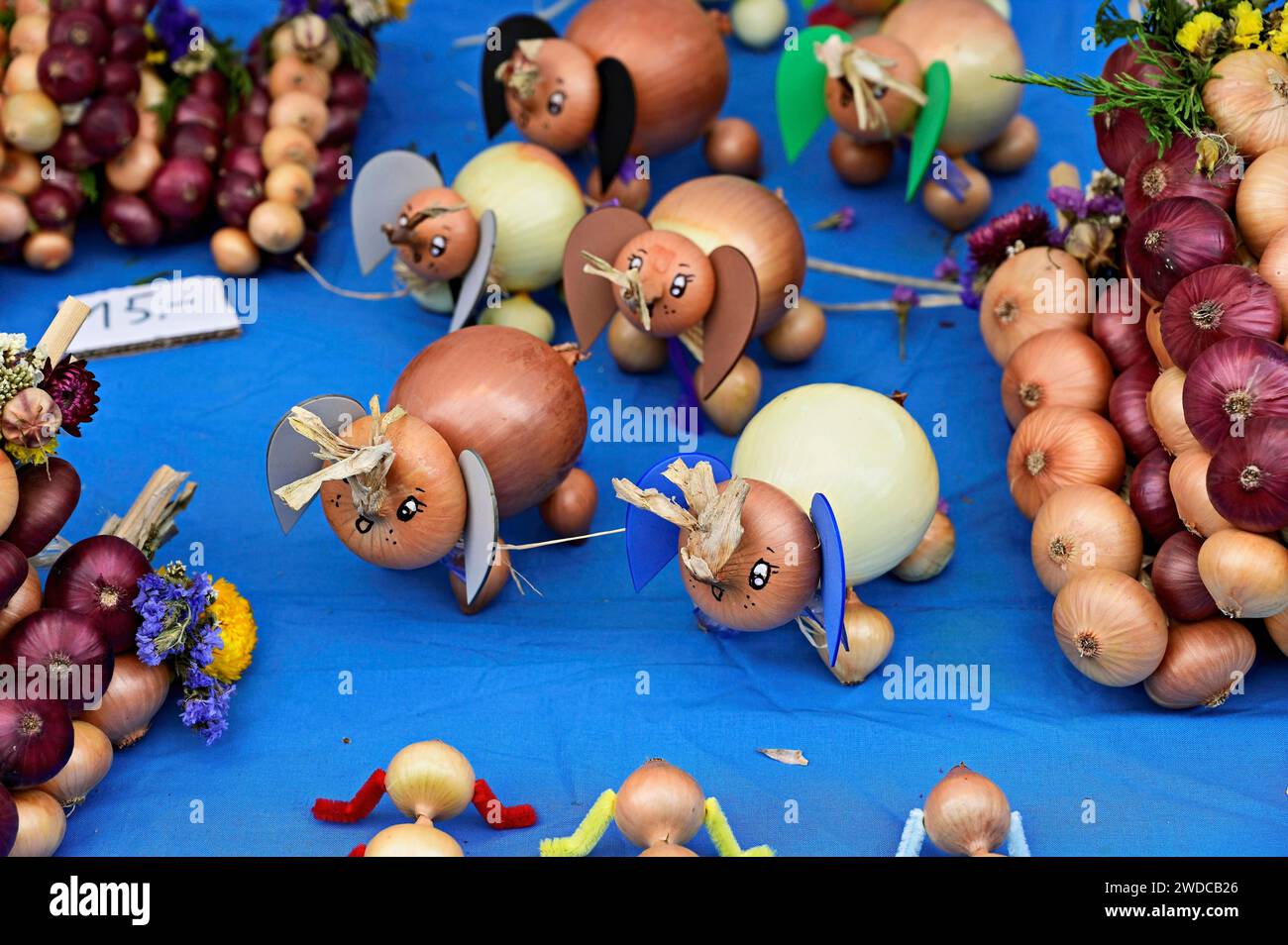 Market stall with onions in the shape of an elephant and onion plaits ...