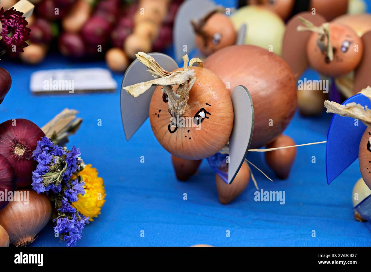 Market stall with onions in the shape of an elephant, onion market ...