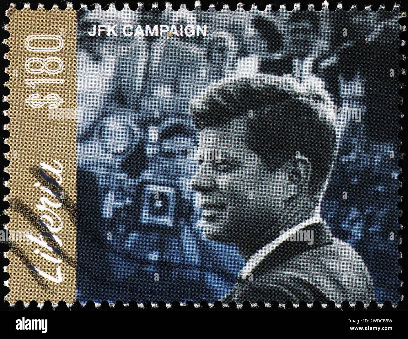 John Kennedy during his campaign to be elected president on stamp Stock ...