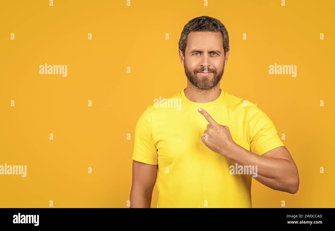 man pointing at advertisement offer in studio. image of man pointing at ...