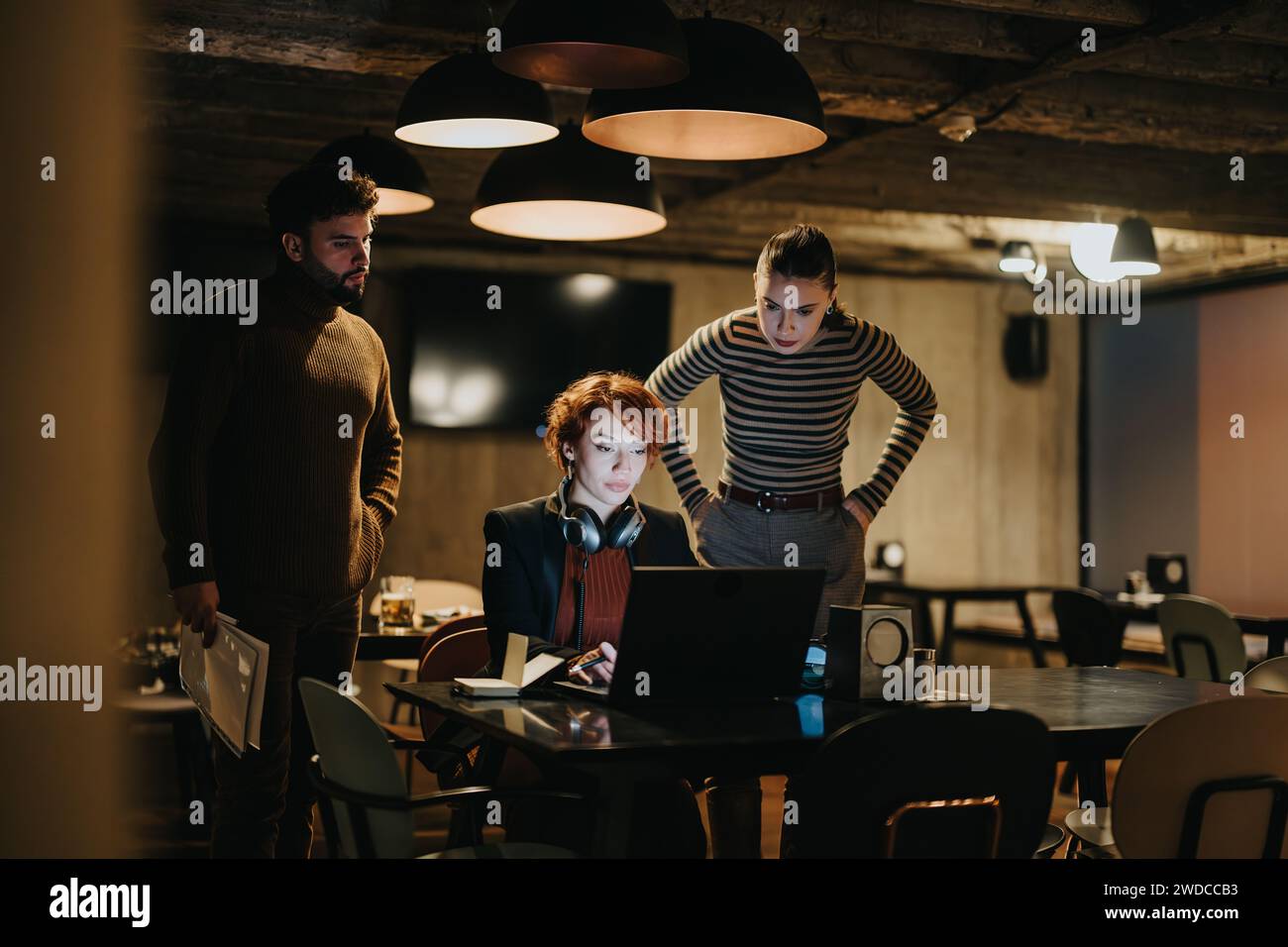 Confident business people working together in a creative office ...
