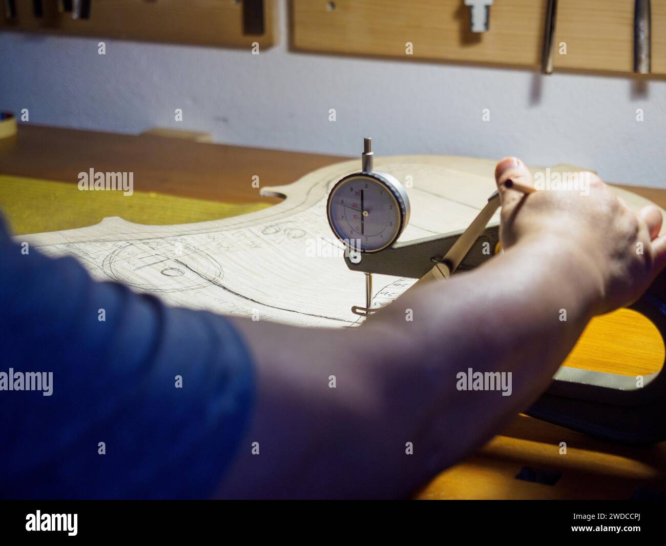 Close up of Stringed instrument maker master luthier hand proceed with ...