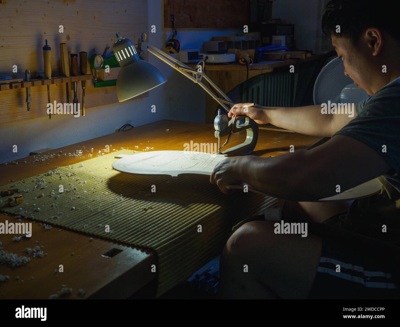 Stringed instrument maker master luthier hand proceed with graduation ...