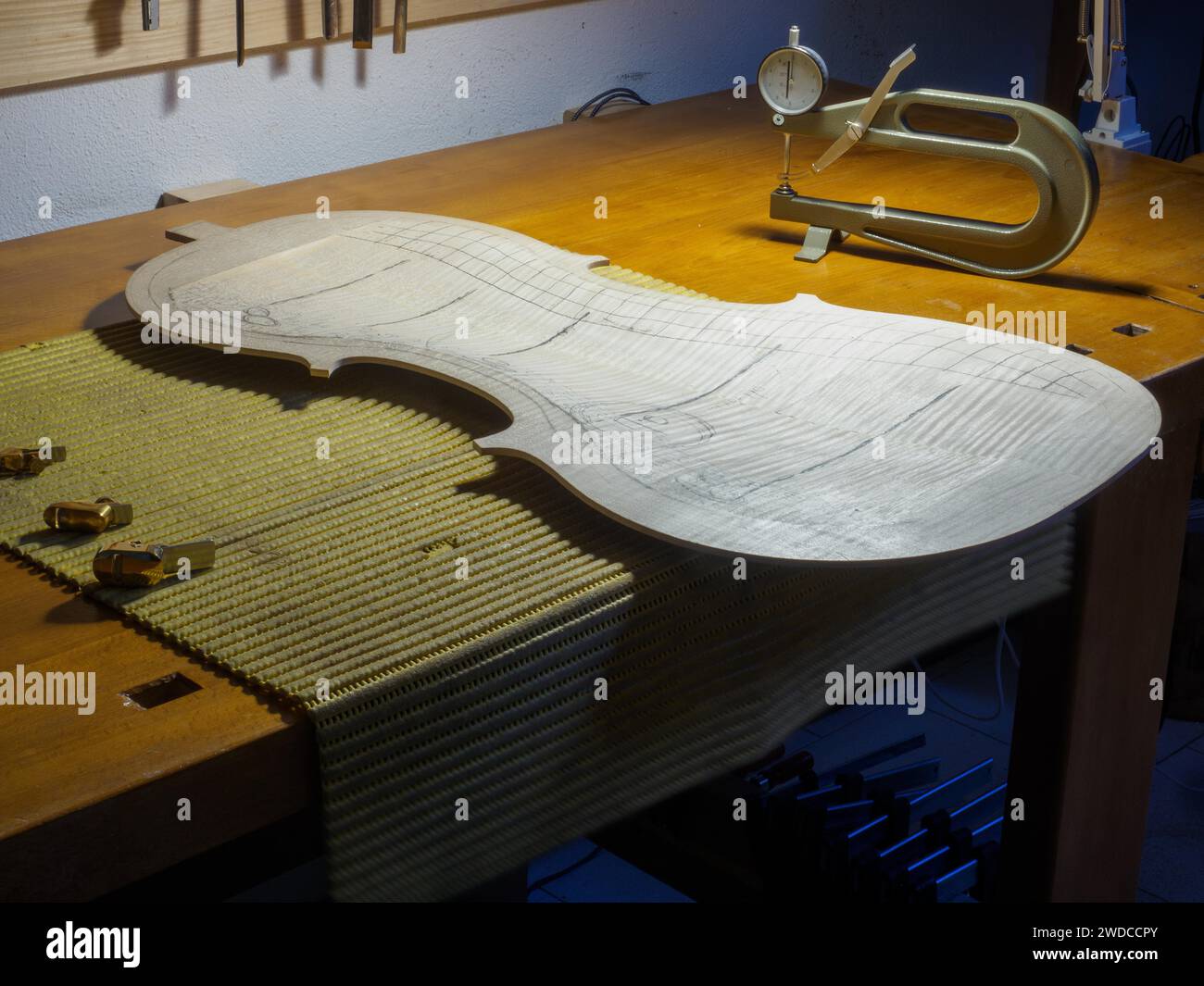 A workbench of a stringed instrument maker master luthier showing a ...