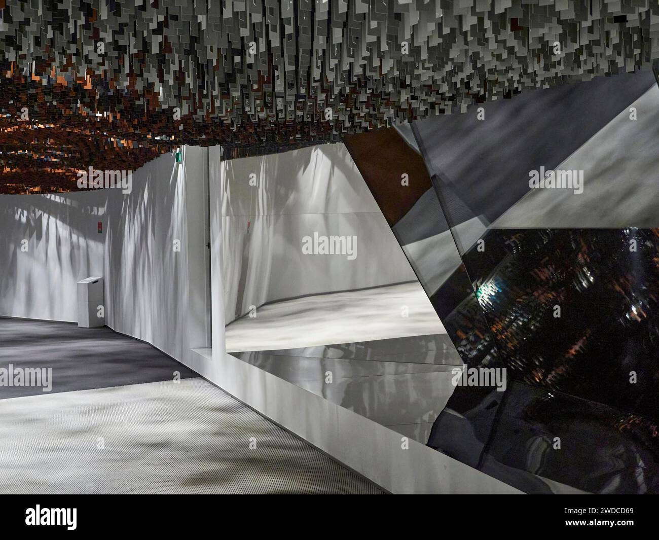 Futuristic interior with geometric shapes and reflective, metallic ...