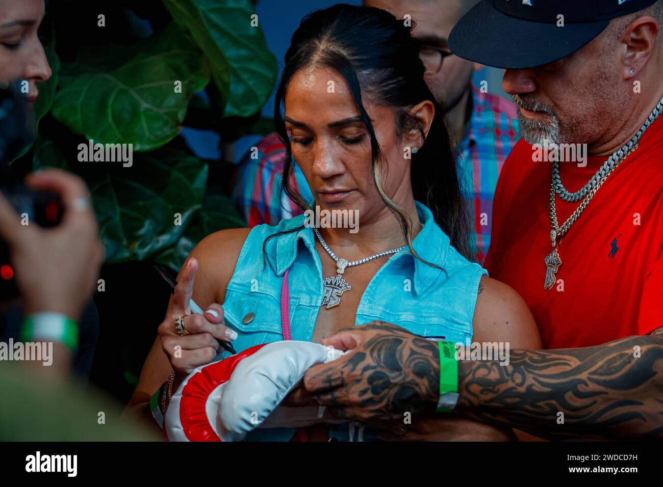 SAN JUAN, PUERTO RICO Amanda Serrano signs boxing glove to a fan, March ...