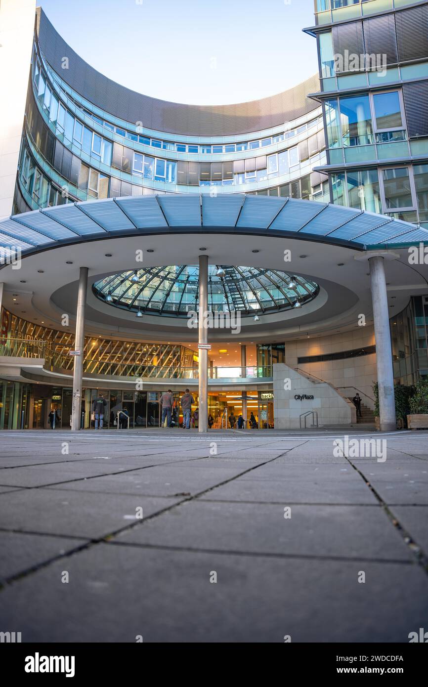 Modern office building with glass facade and curved canopy in the ...
