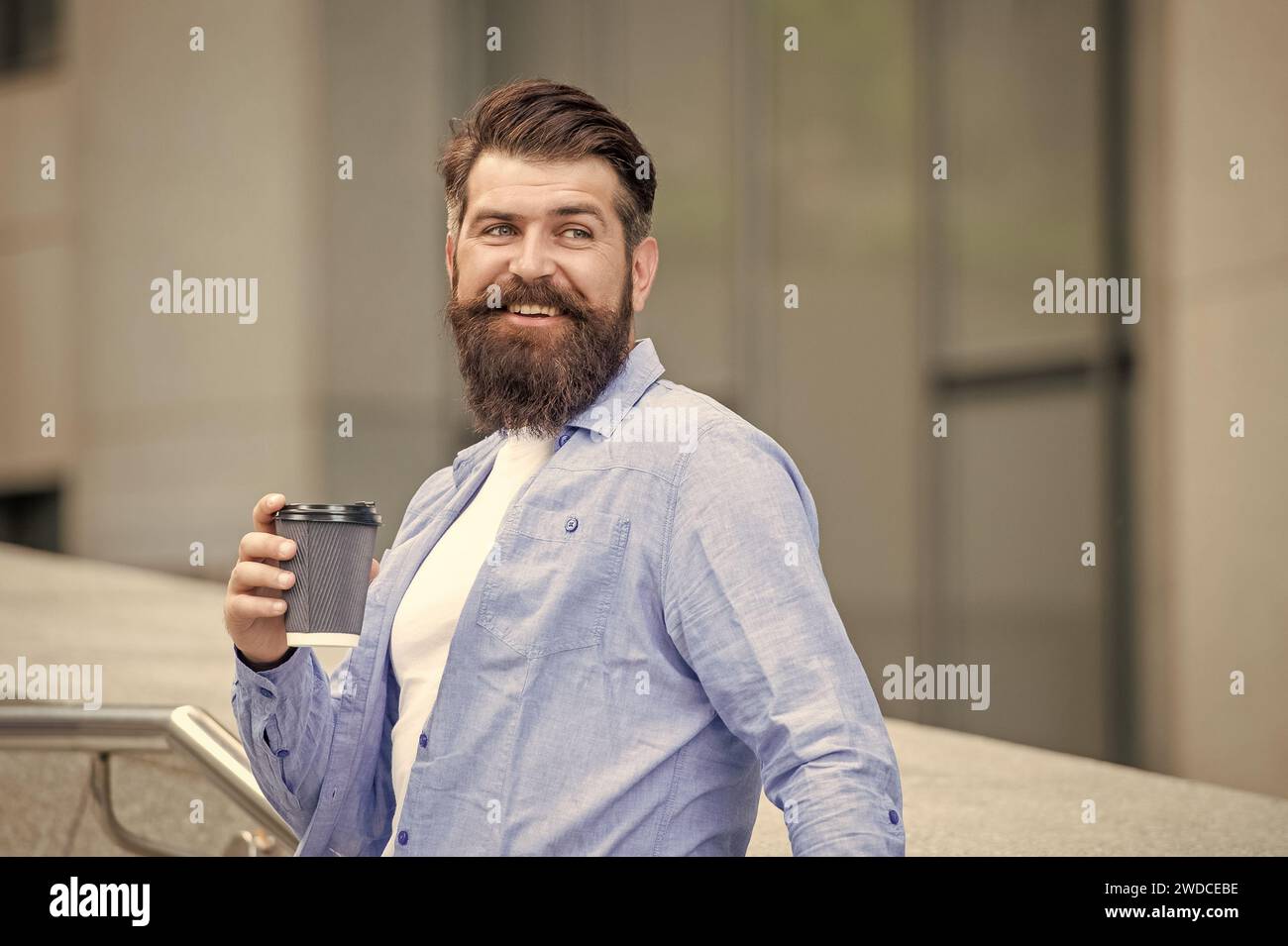 glad man with morning coffee outside. man with morning coffee in the ...