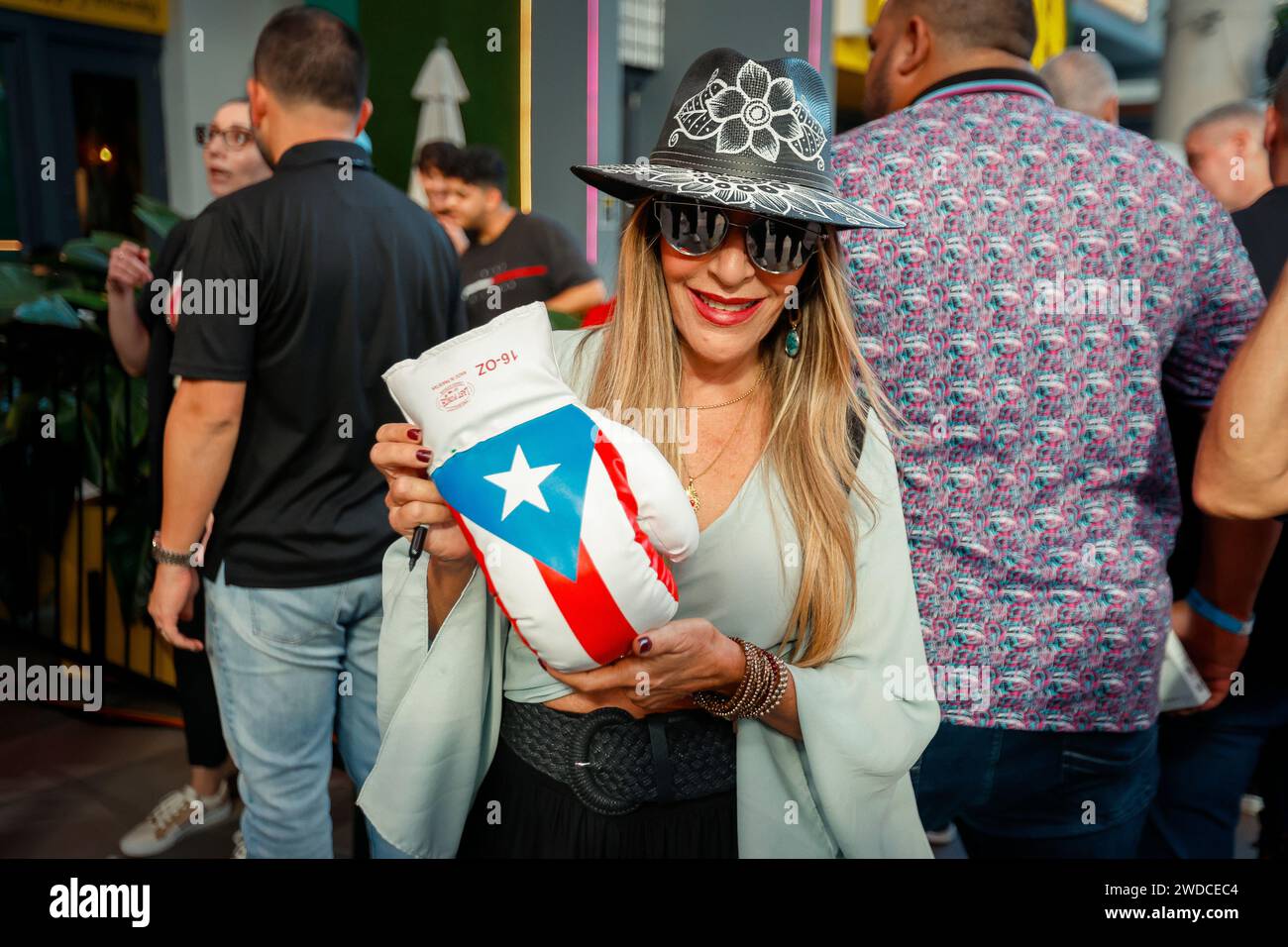 SAN JUAN, PUERTO RICO A Puerto Rican boxing fan waiting for the signing ...