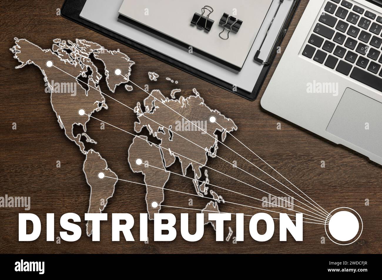 Distribution. Laptop and different stationery on wooden desk, flat lay ...