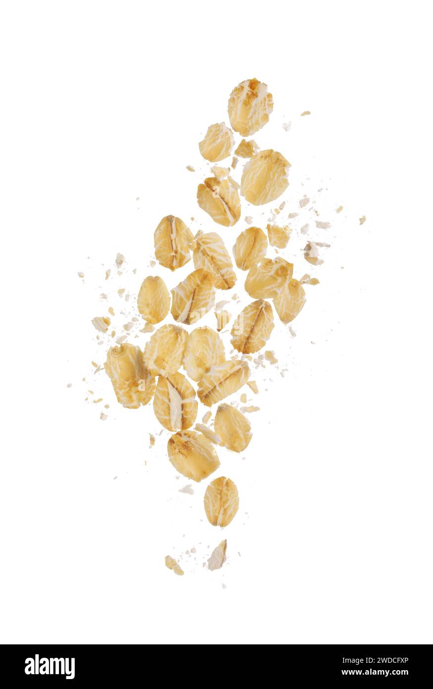 Dry oat flakes falling on white background Stock Photo - Alamy