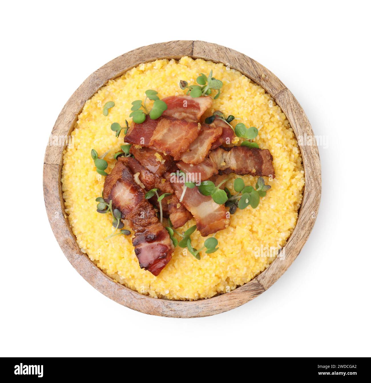Cooked cornmeal with bacon and microgreens in bowl isolated on white ...