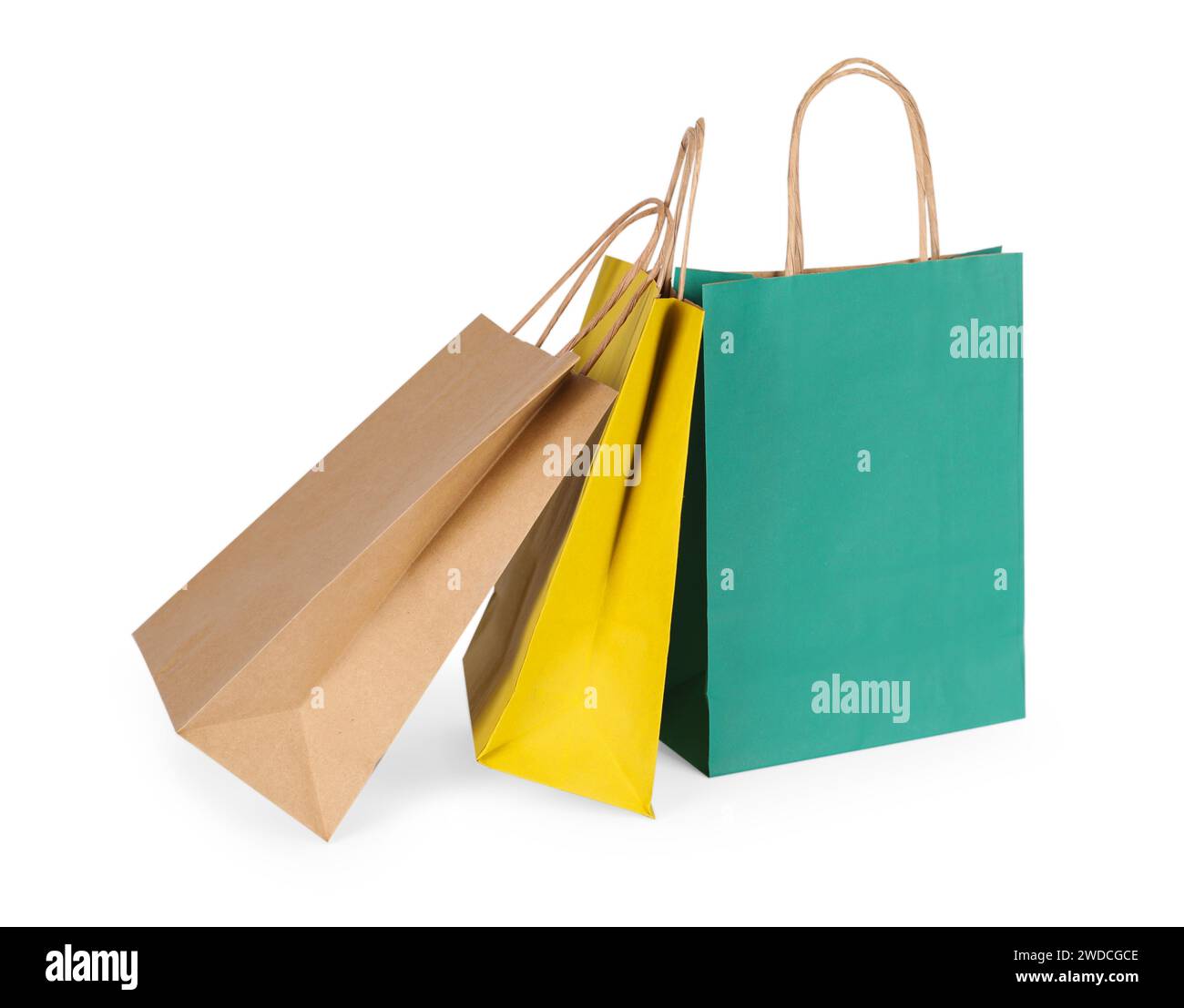 Three paper shopping bags on white background Stock Photo - Alamy