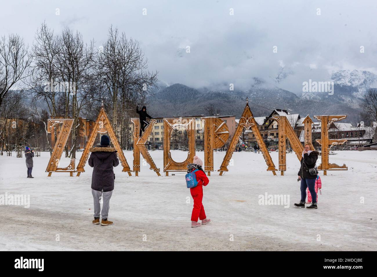 Zakopane, Poland. 19th Jan, 2024. Families take a photo in a public ...