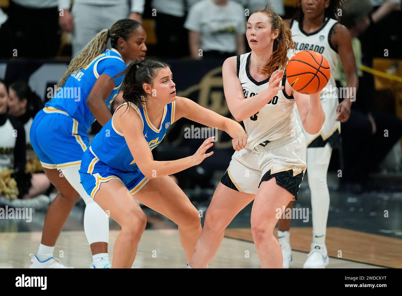 Colorado guard Frida Formann, right, passes the ball as UCLA forward ...