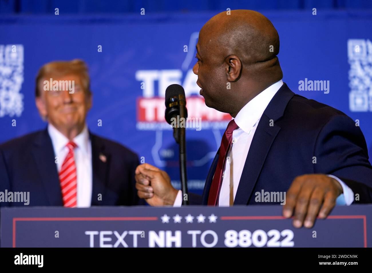 Republican presidential candidate former President Donald Trump listens ...