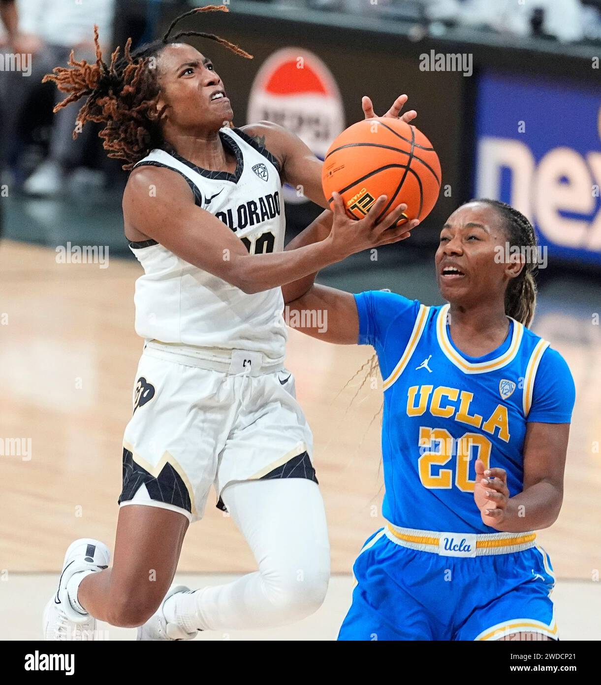 Colorado guard Jaylyn Sherrod, left, is fouled by UCLA guard Charisma ...