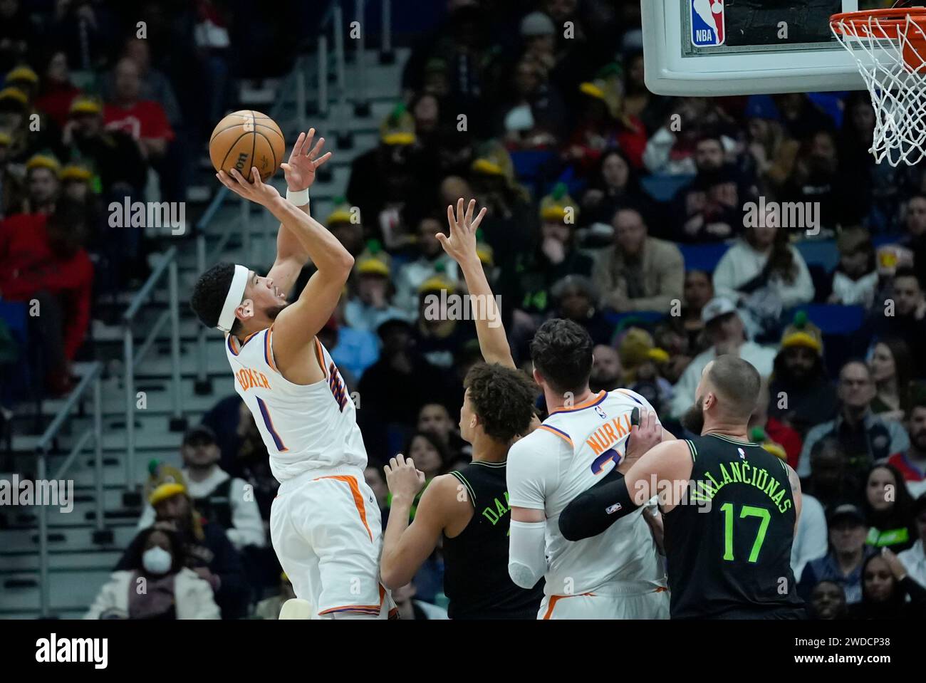 Phoenix Suns guard Devin Booker (1) shoots against New Orleans Pelicans ...