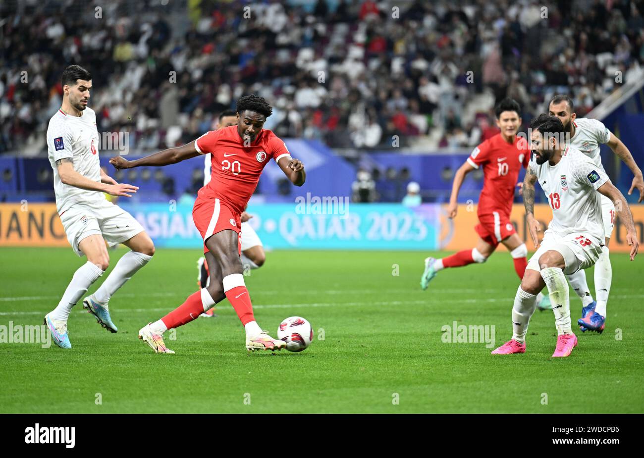 Doha, Qatar. 19th Jan, 2024. Michael Udebuluzor (2nd L) of China's Hong ...