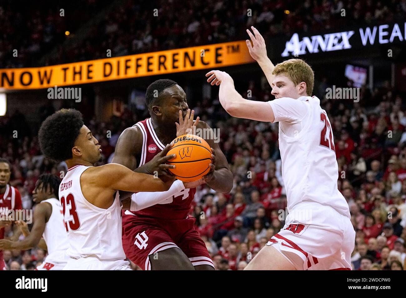 Wisconsin's Chucky Hepburn (23) tries to take the ball from Indiana's ...
