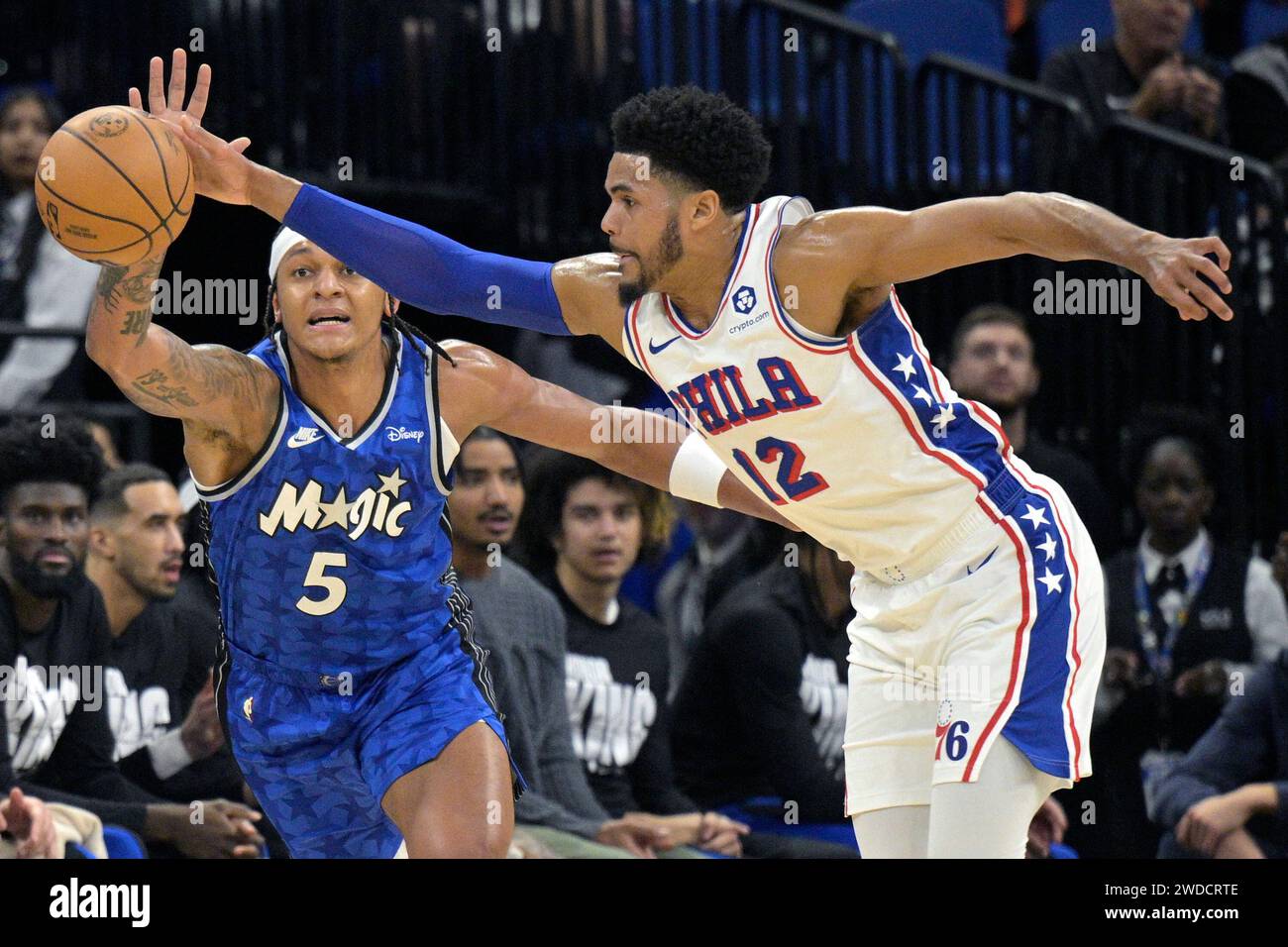 Orlando Magic forward Paolo Banchero (5) and Philadelphia 76ers forward Tobias Harris (12 ...