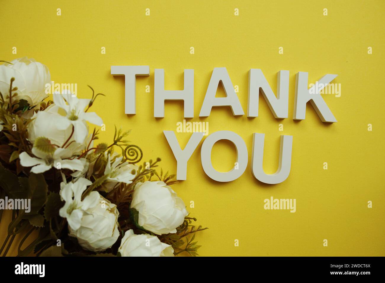 Thank You alphabet letters decorate with Flowers on Yellow background ...