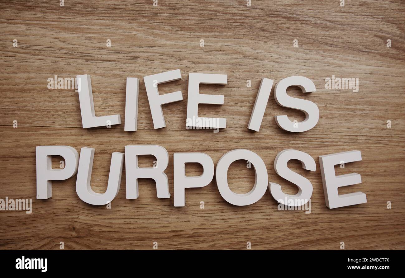 Life is Purpose alphabet letters on wooden background Stock Photo - Alamy
