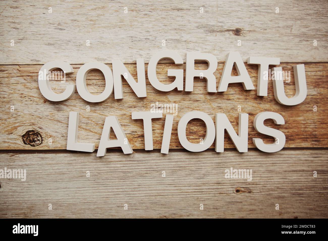 Congratulations alphabet letters on wooden background Stock Photo - Alamy