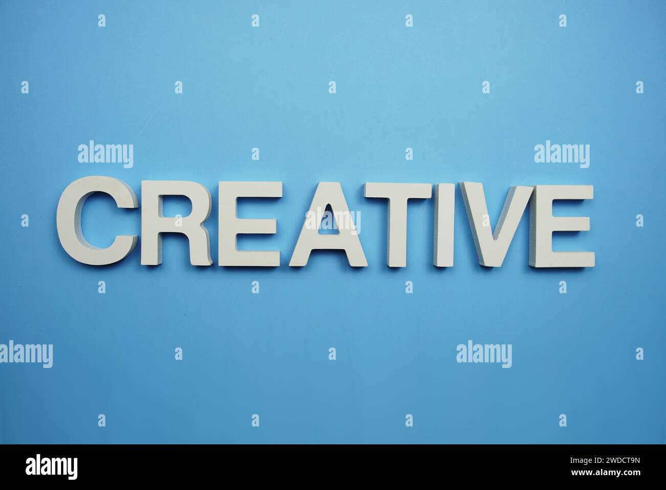 Creative alphabet letters on blue background Stock Photo - Alamy