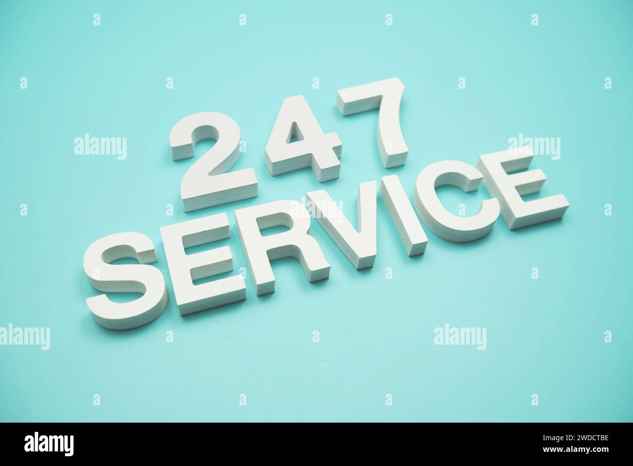 24/7 Service alphabet letters on blue background Stock Photo - Alamy