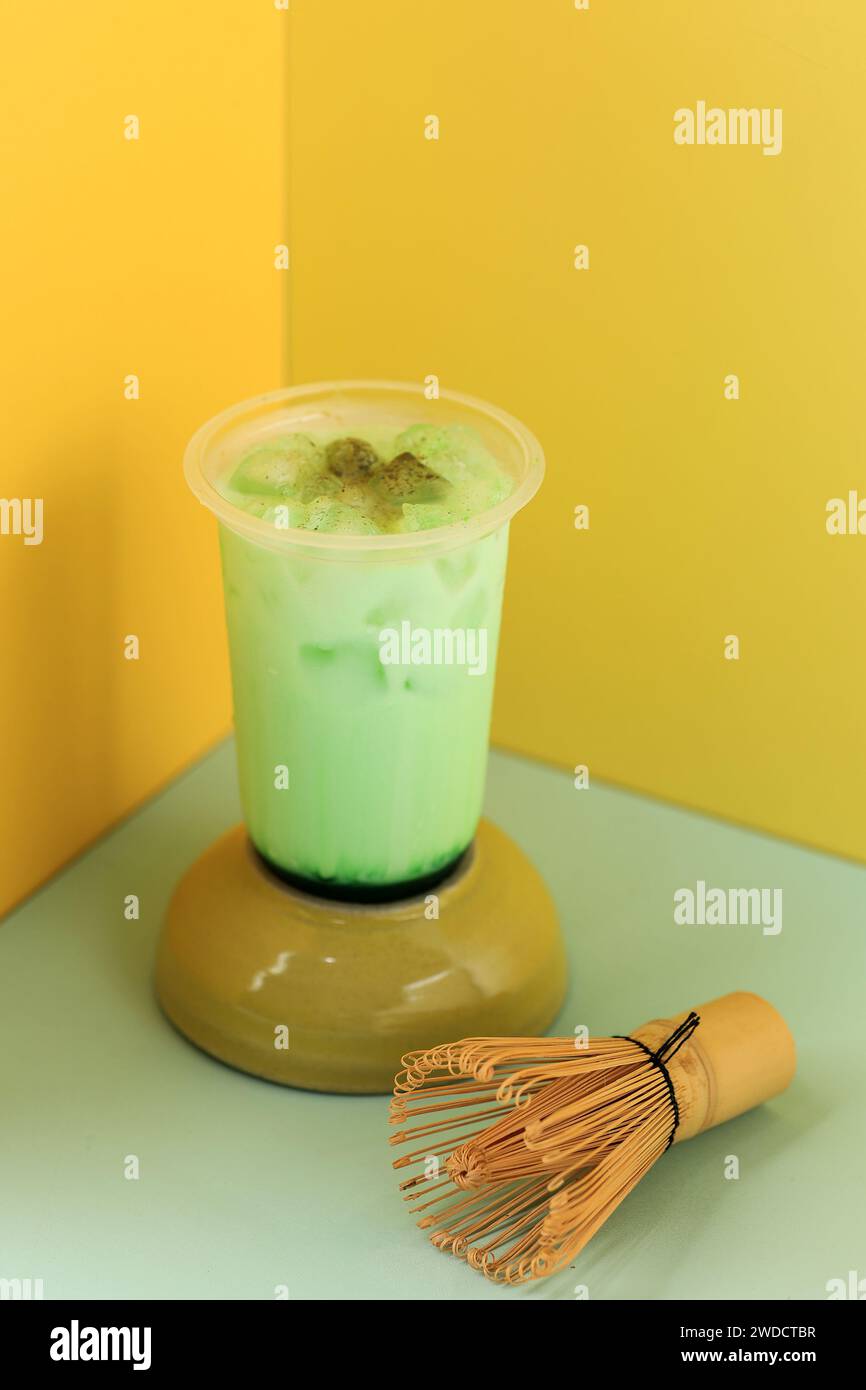 Green Tea Matcha Mil Tea Latte on Yellow Background Stock Photo - Alamy
