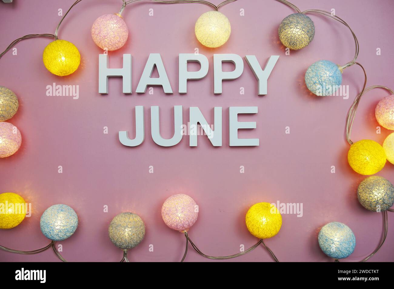 Happy June alphabet letters on pink background Stock Photo - Alamy