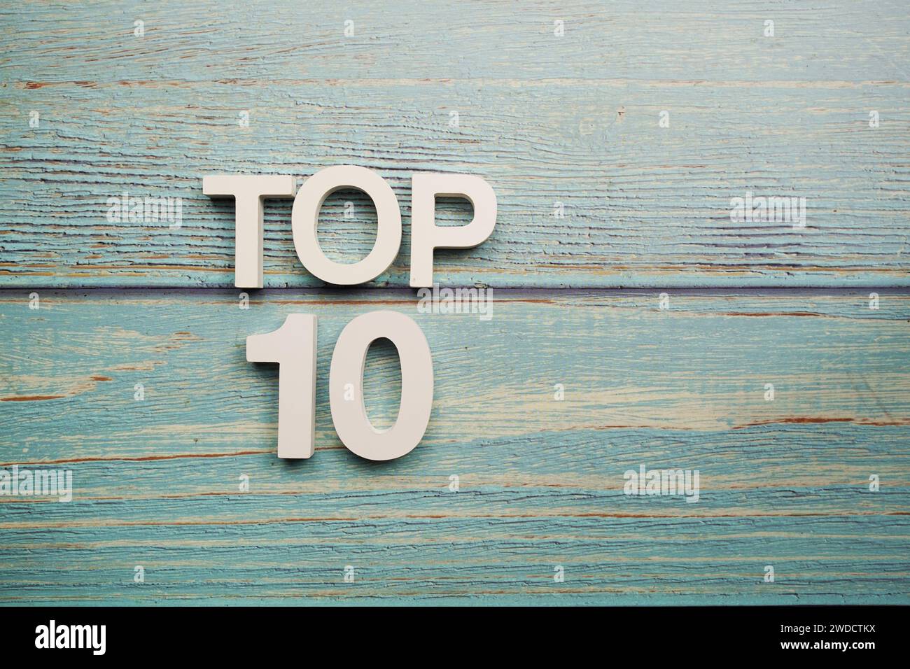 Top 10 alphabet letters on wooden background Stock Photo - Alamy