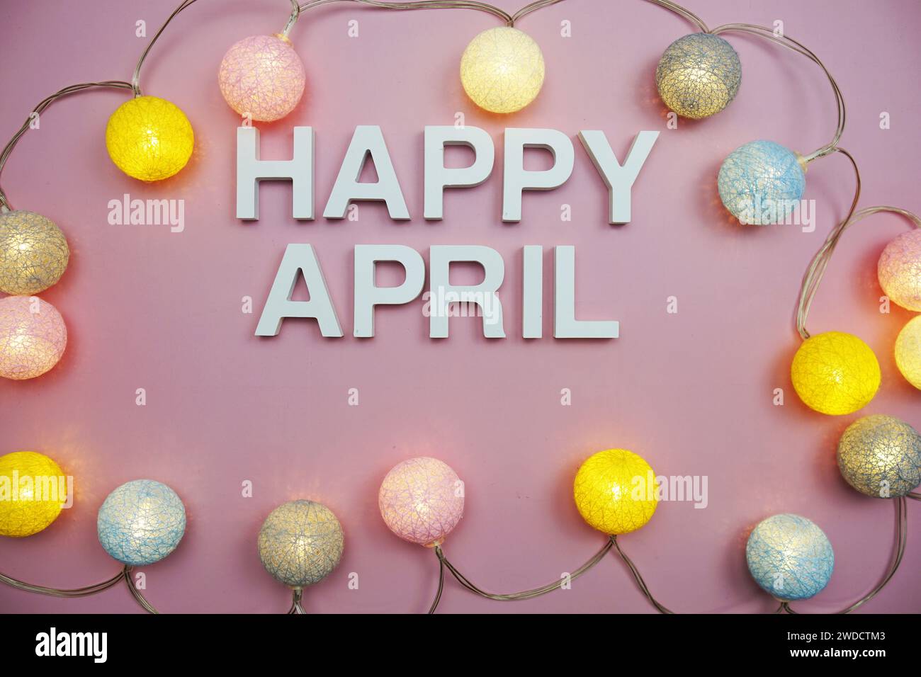 Happy April alphabet letters on pink background Stock Photo - Alamy