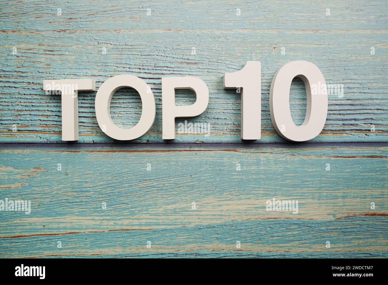 Top 10 alphabet letters on wooden background Stock Photo - Alamy