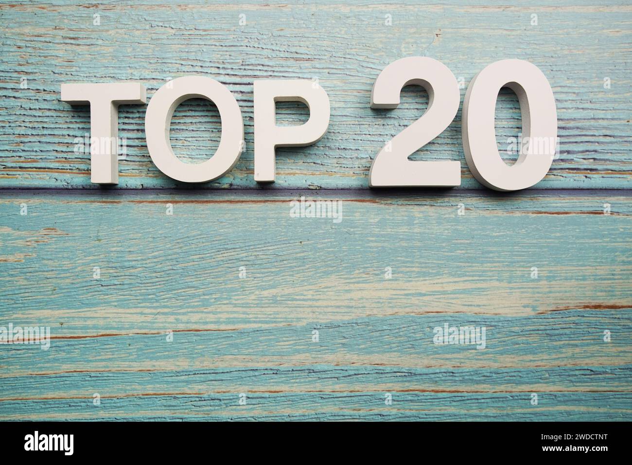 Top 10 alphabet letters on wooden background Stock Photo - Alamy
