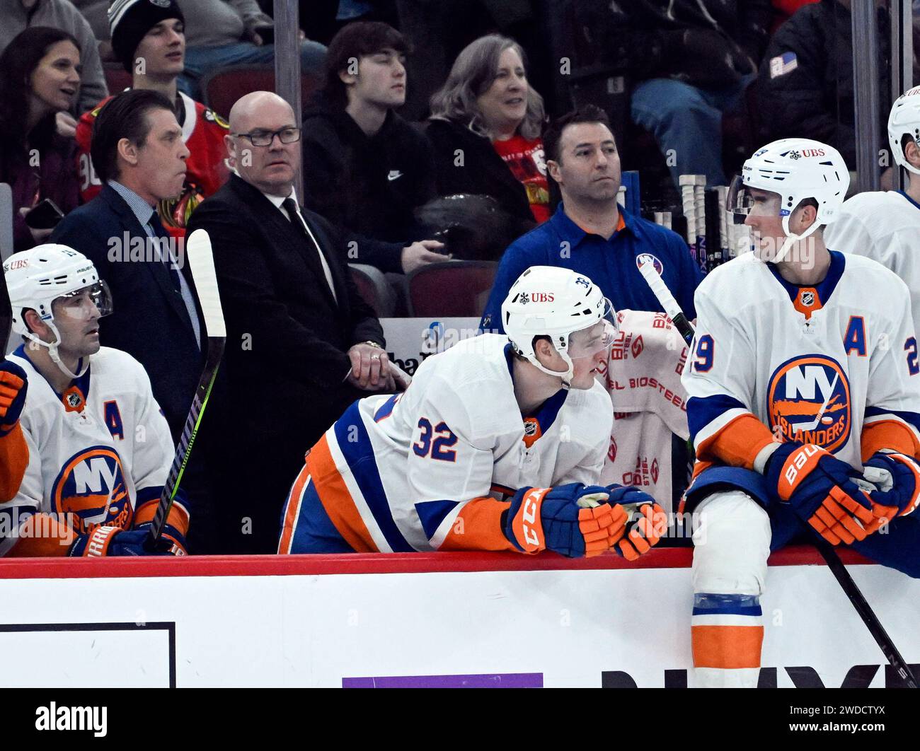 New York Islanders center Kyle MacLean (32) leans over the bench rail ...