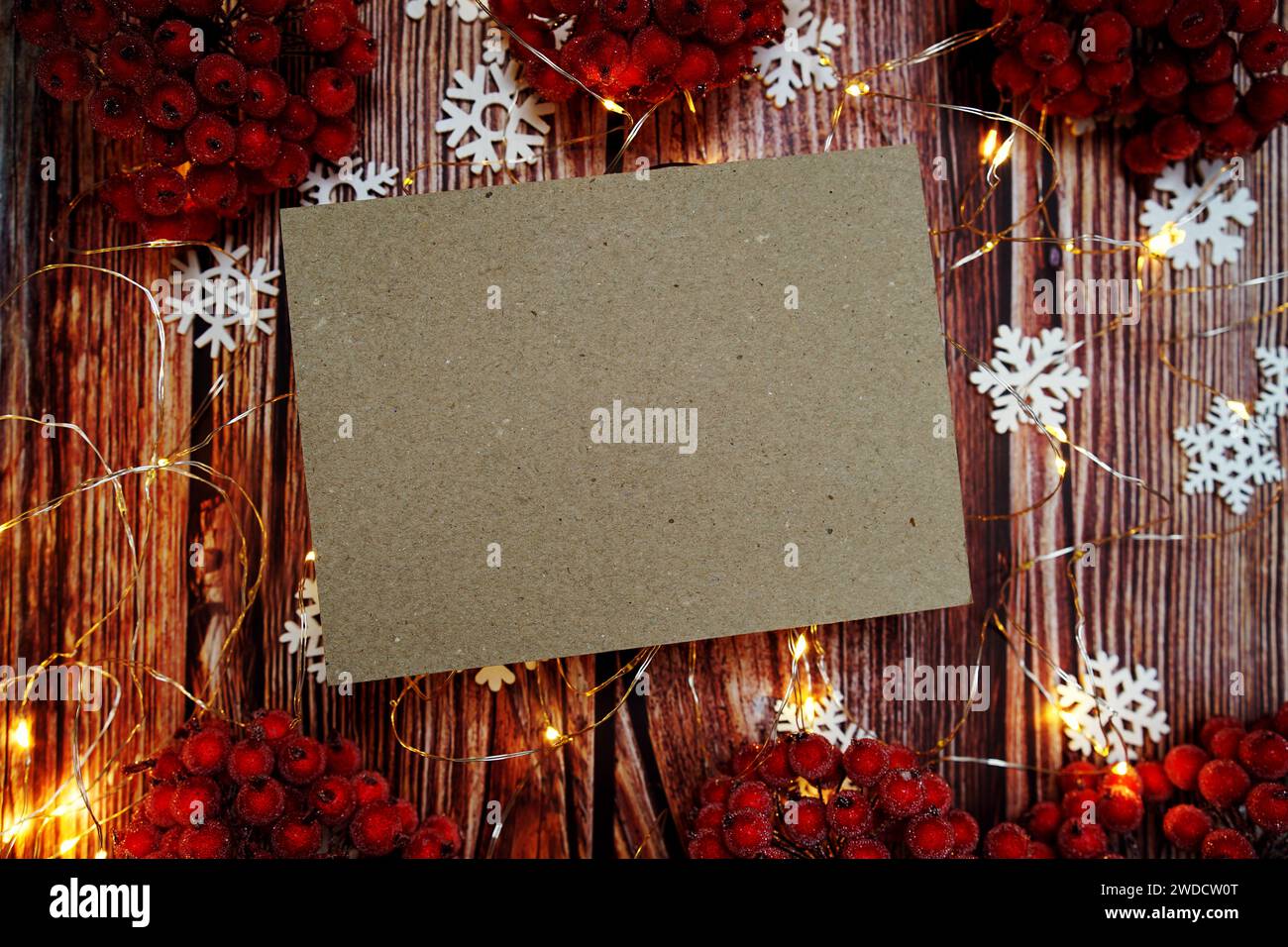 Empty paper craft for copy decorate with snowflake and red berries on ...