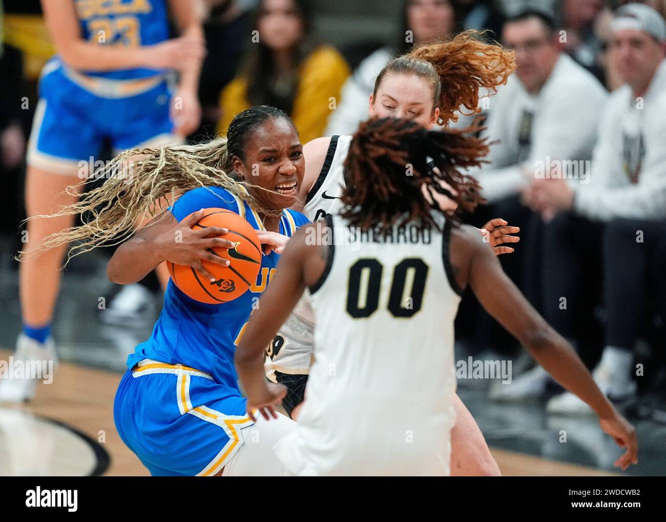 UCLA guard Charisma Osborne, middle, is trapped with the ball by ...